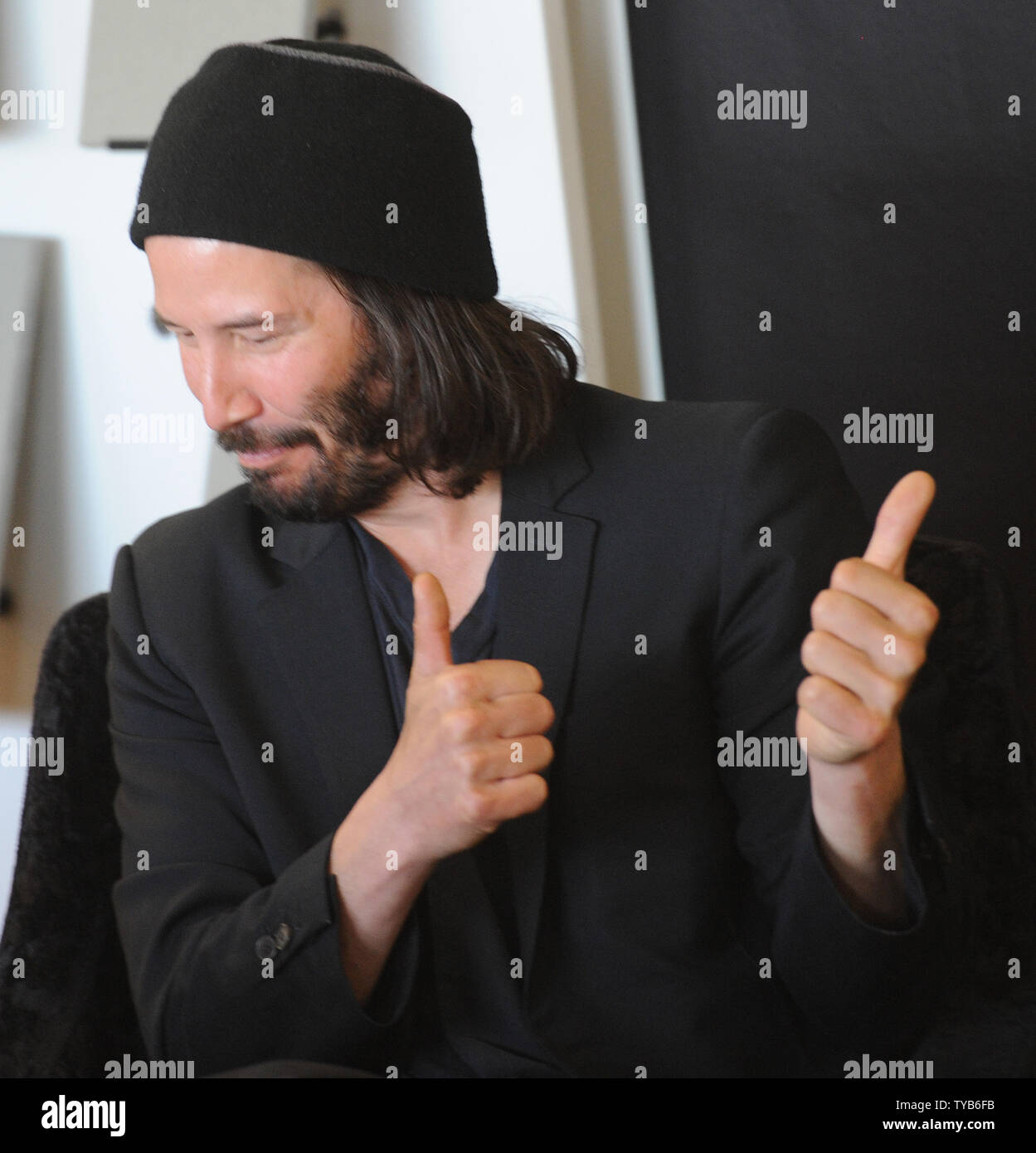 American actor Keanu Reeves attends a signing of his new book "Ode To ...