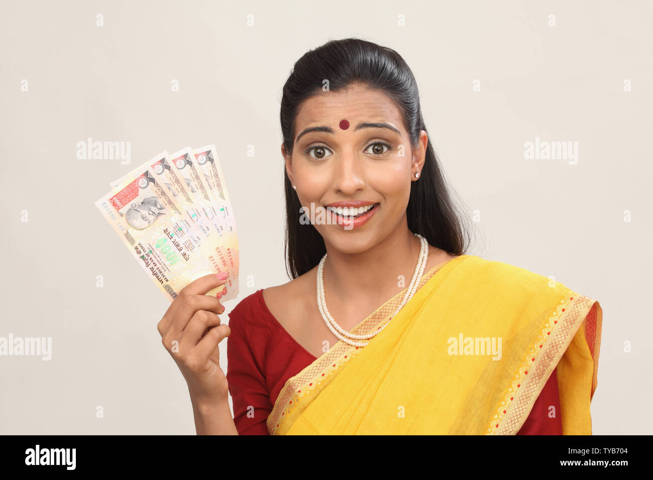 Woman holding indian paper currency hi-res stock photography and images ...