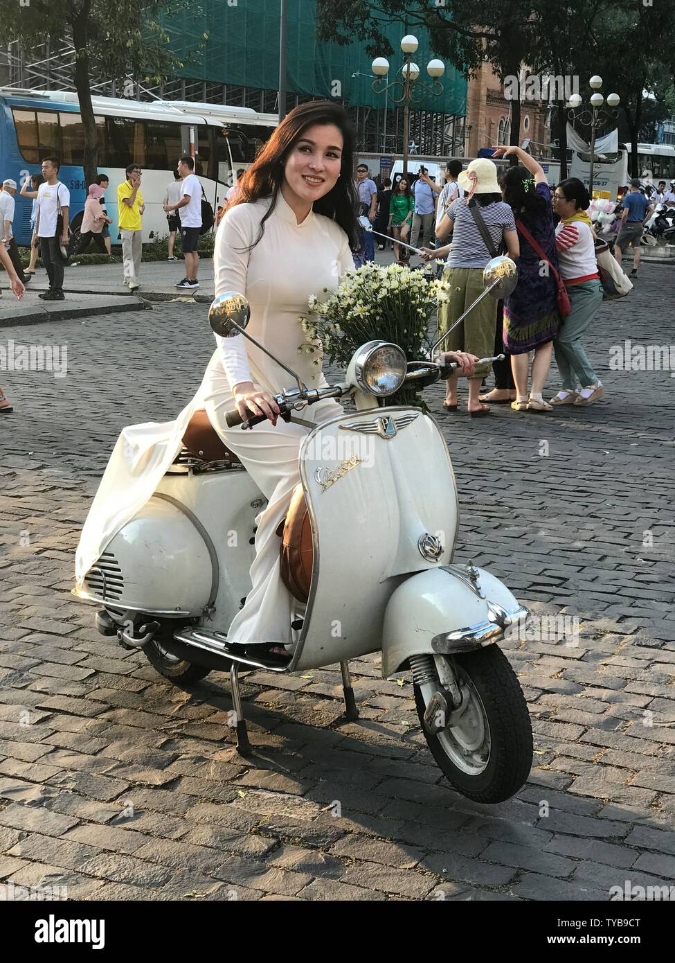 A model - Girl in a traditional Ao Dai on a Motorbike in Saigon - Ho ...
