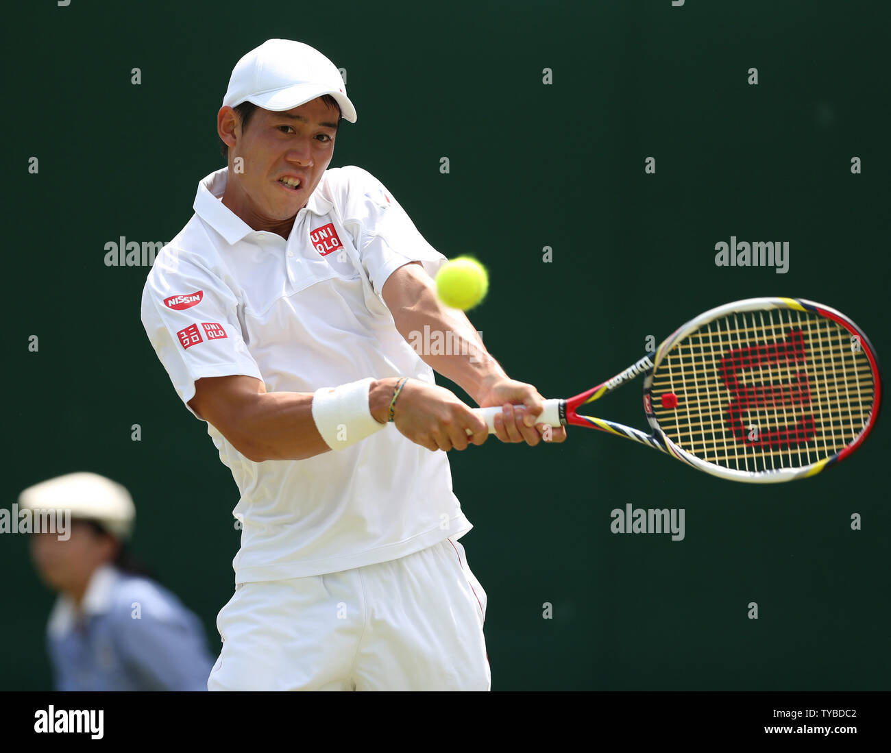 Japan's Kei Nishikori returns in his match against France's Florent ...