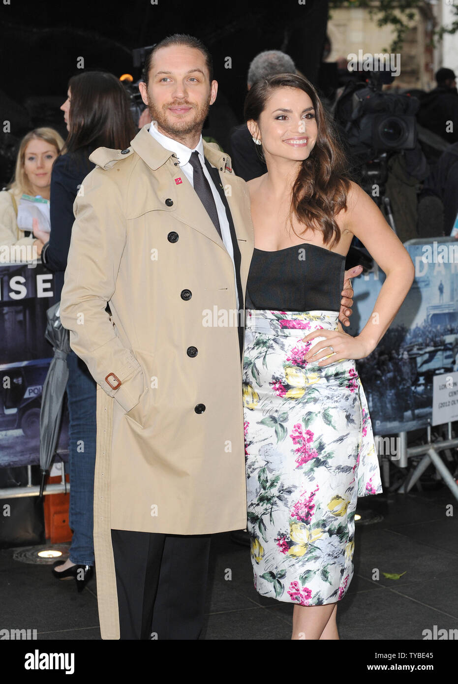 English actor Tom Hardy and his girlfriend Charlotte Riley attend the ...