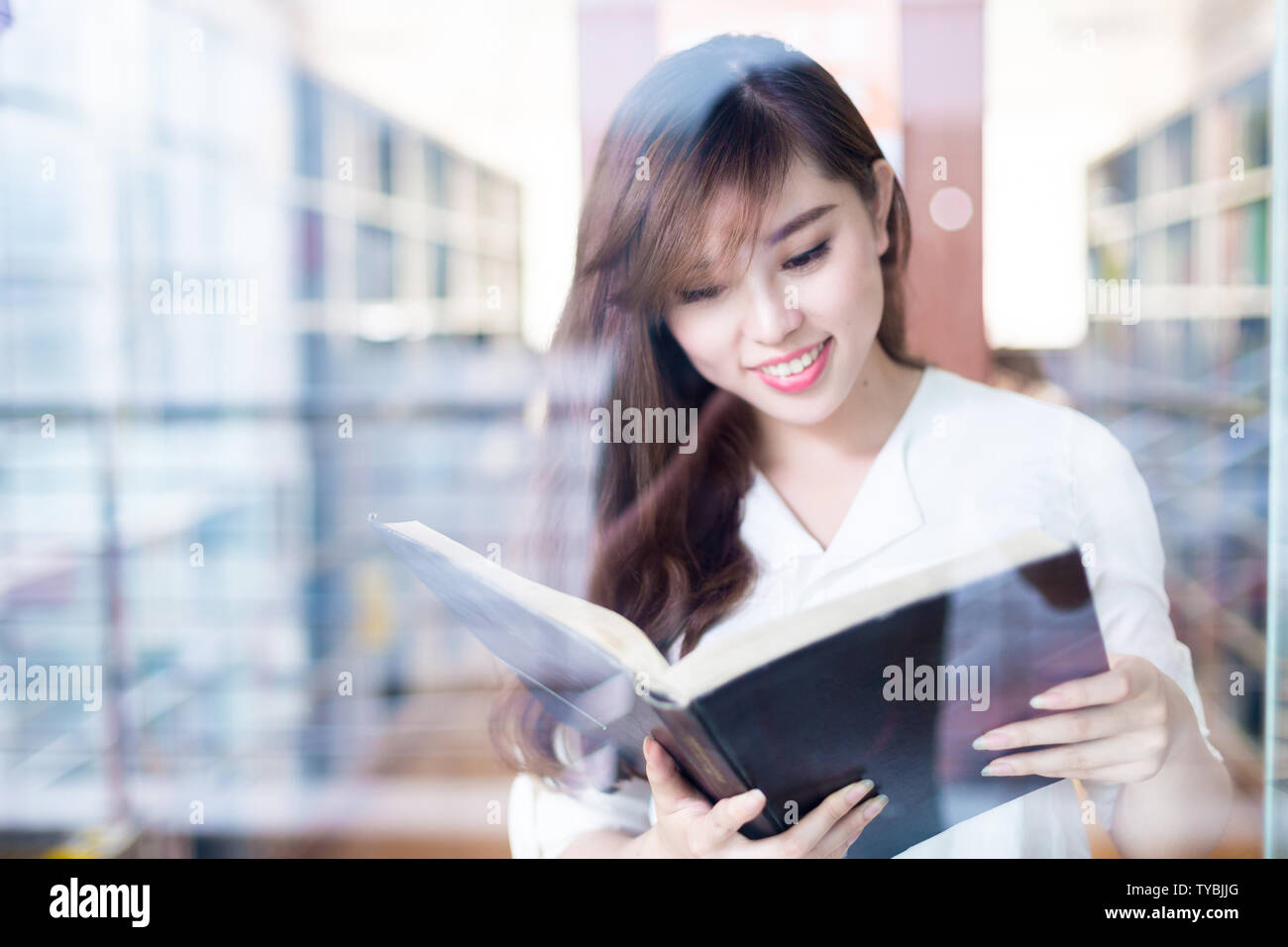 young beautiful asian girl university student in library Stock Photo ...