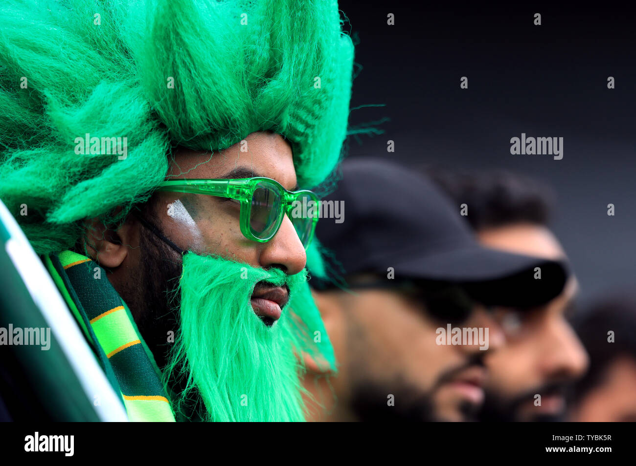 A Pakistan fan in the stands as they wait for the start of play during ...