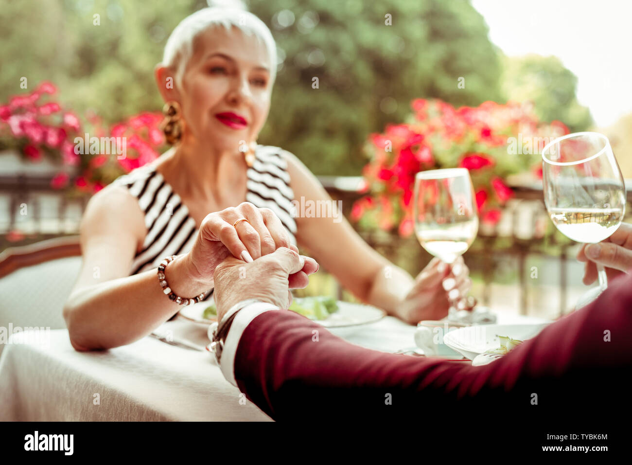 Wife touching hand of her supportive loving husband Stock Photo - Alamy