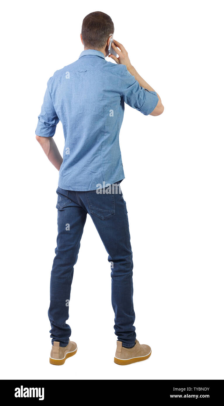back view of a man talking on the phone. backside view of person. The ...