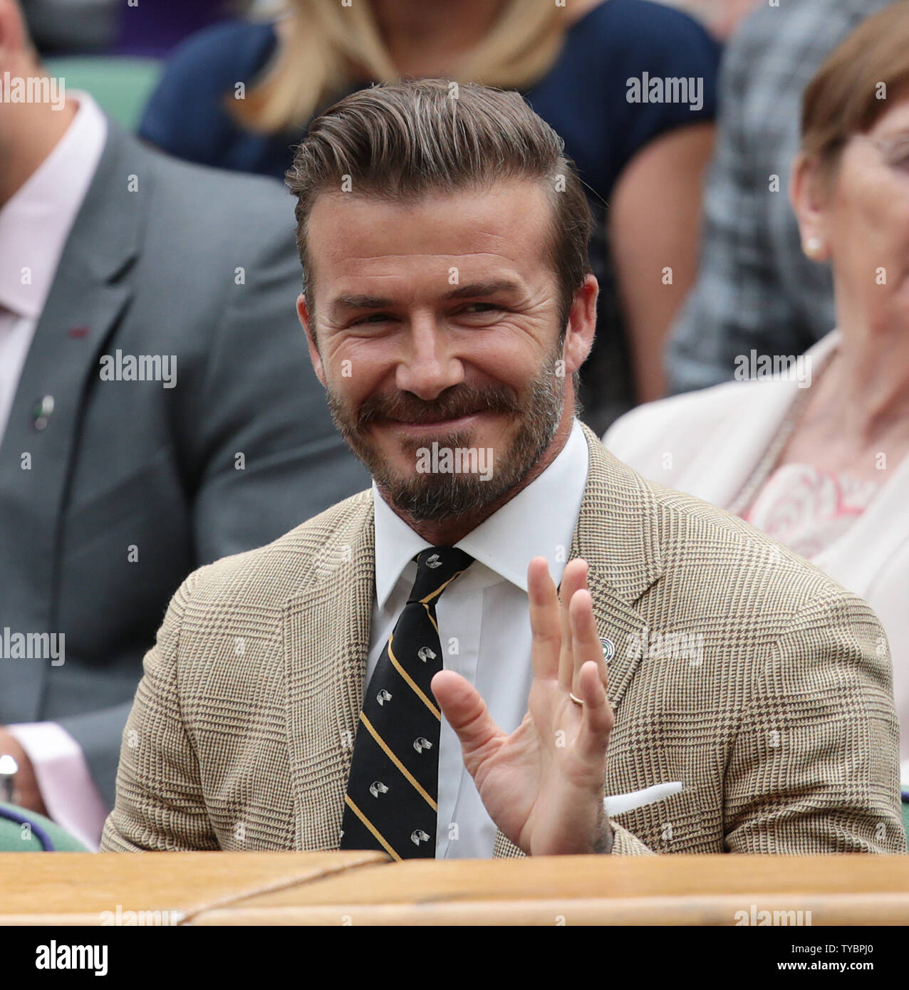 Footballer David Beckham watches the tennis from the Royal Box on day ...