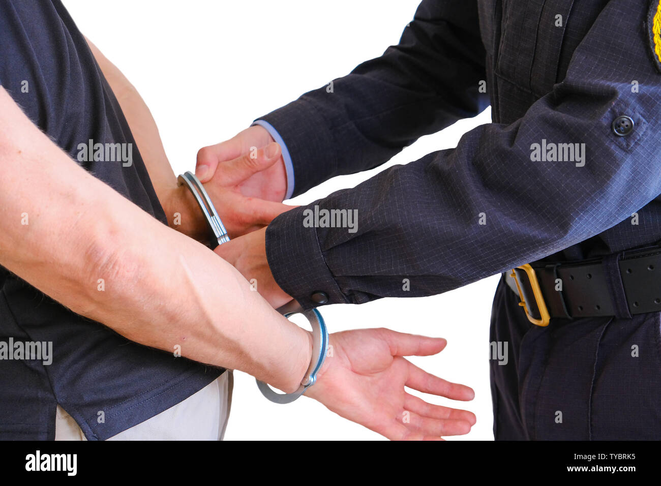 Buttons COP handcuffs an arrested criminal. The man at the police ...