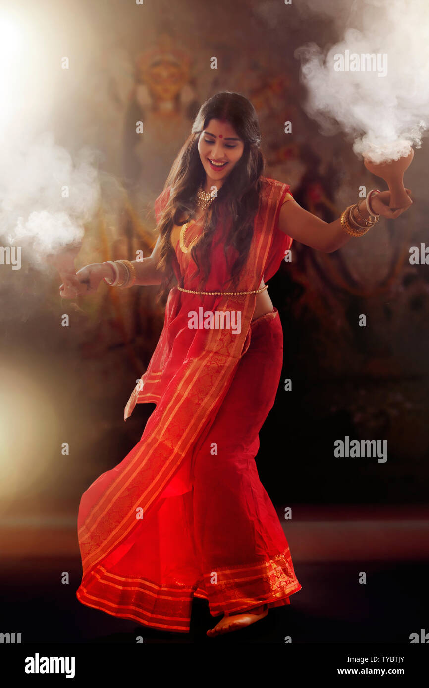 Bengali Married women performing dhunuchi dance on the occasion of ...