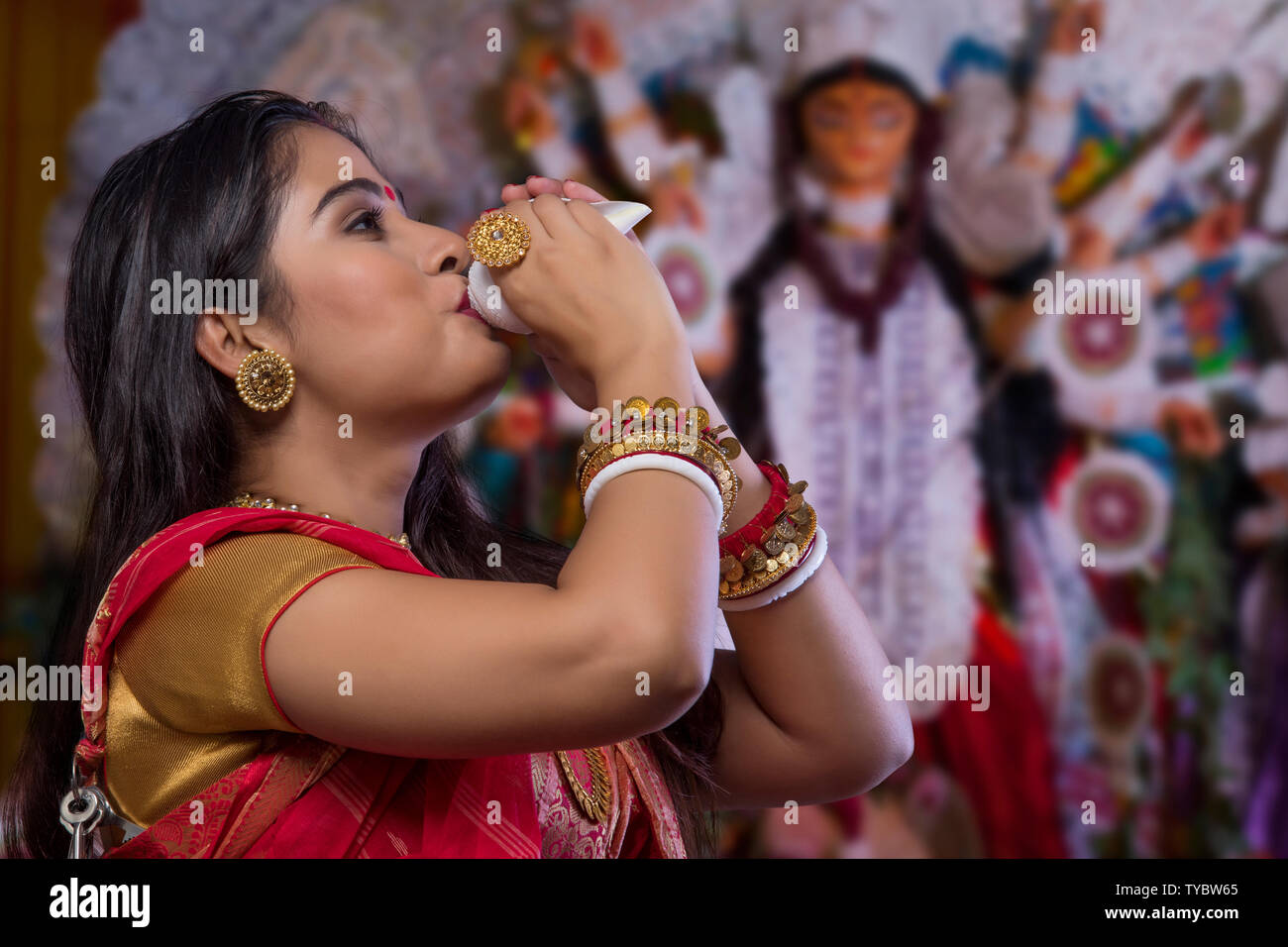 Blowing conch shell hi-res stock photography and images - Alamy