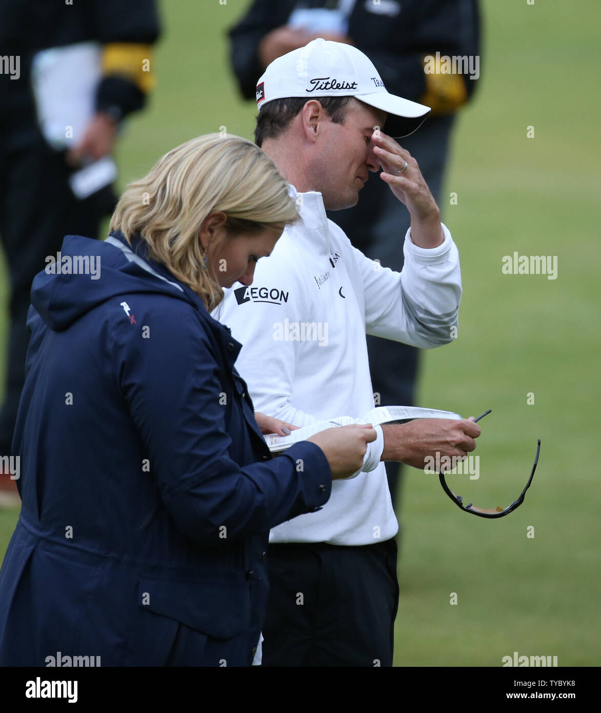 American Zach Johnson holds back tears with his wife Kim after winning ...