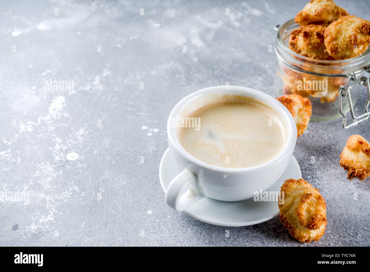 French coconut cookies congolais with coffee mug, grey stone or ...