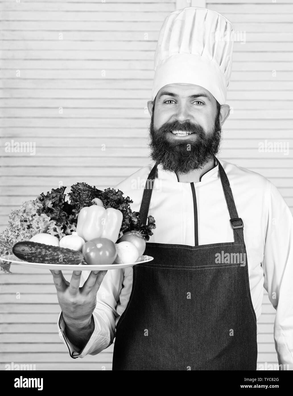 Handsome chef presenting meal hi-res stock photography and images - Alamy