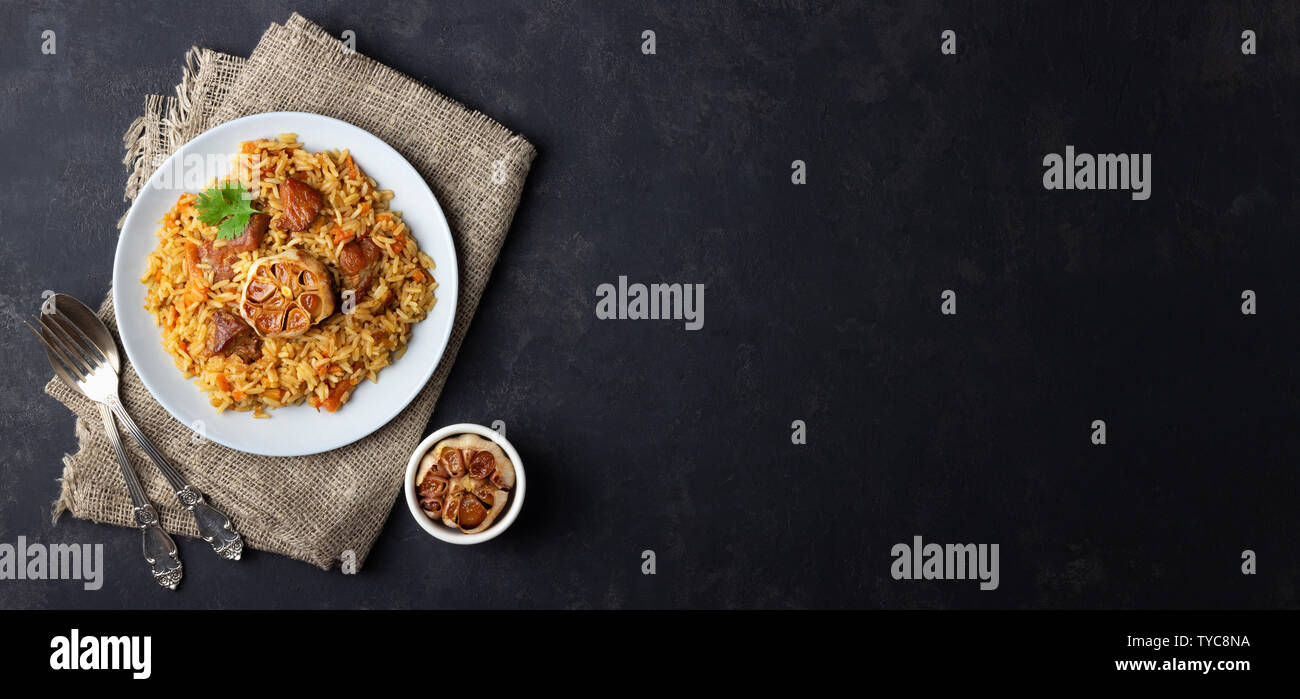 Traditional asian dish - pilaf from from rice, vegetables and meat in a ...
