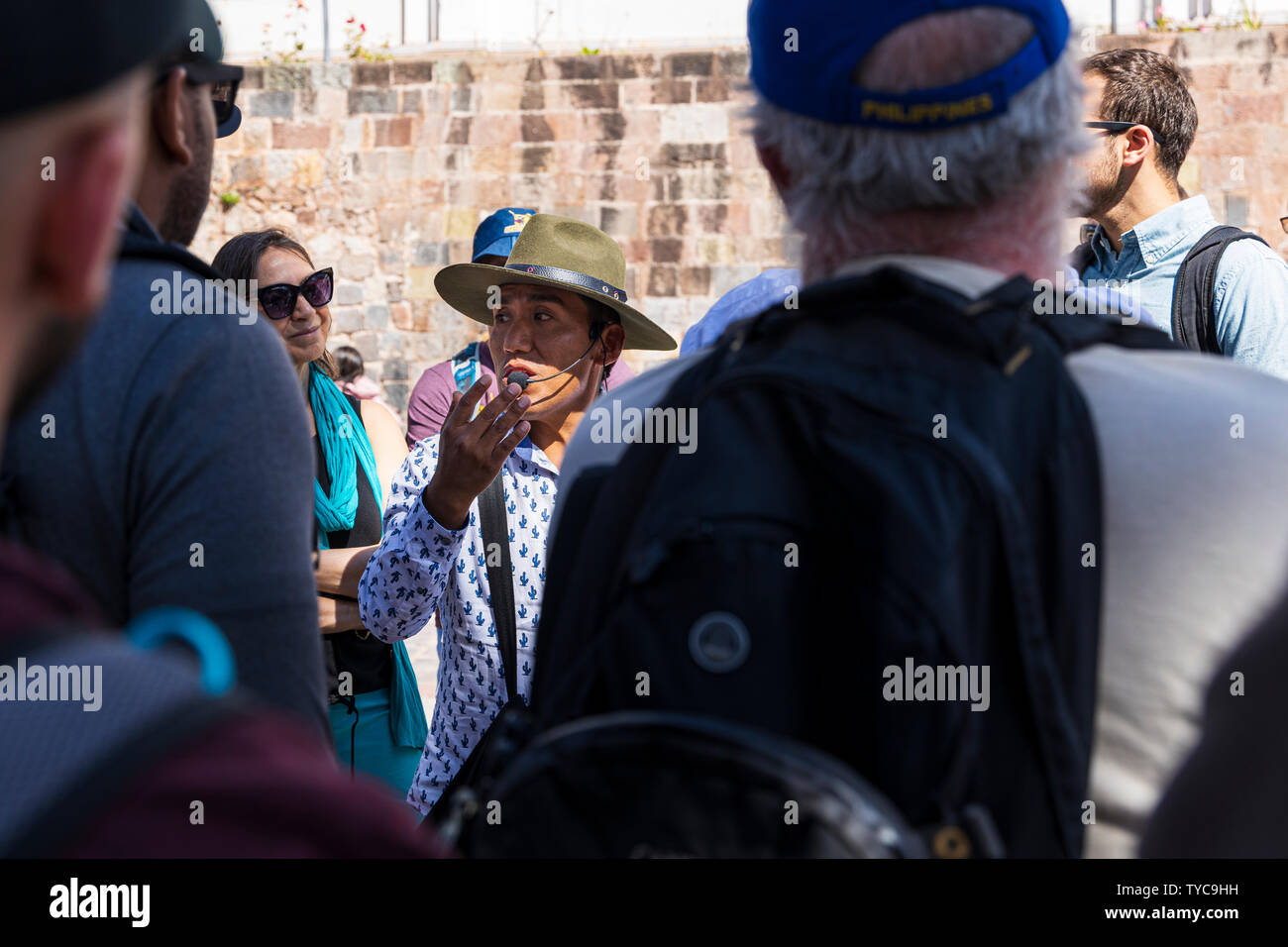 Tour guide on a walking tour talking to tourists in Cusco, Peru, South ...
