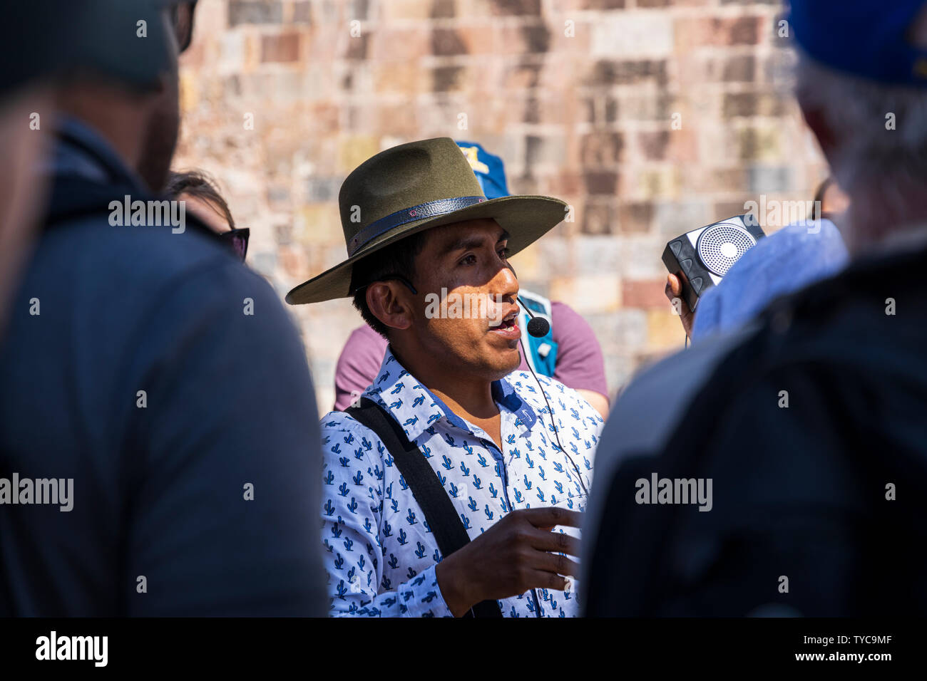 Tour guide on a walking tour talking to tourists in Cusco, Peru, South ...