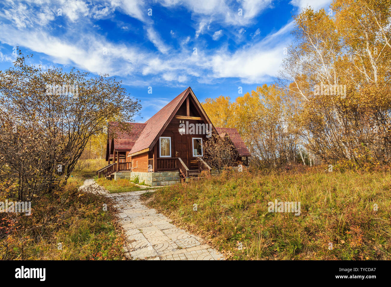 Paddock dam on sun lake lake wooden house autumn color Stock Photo - Alamy