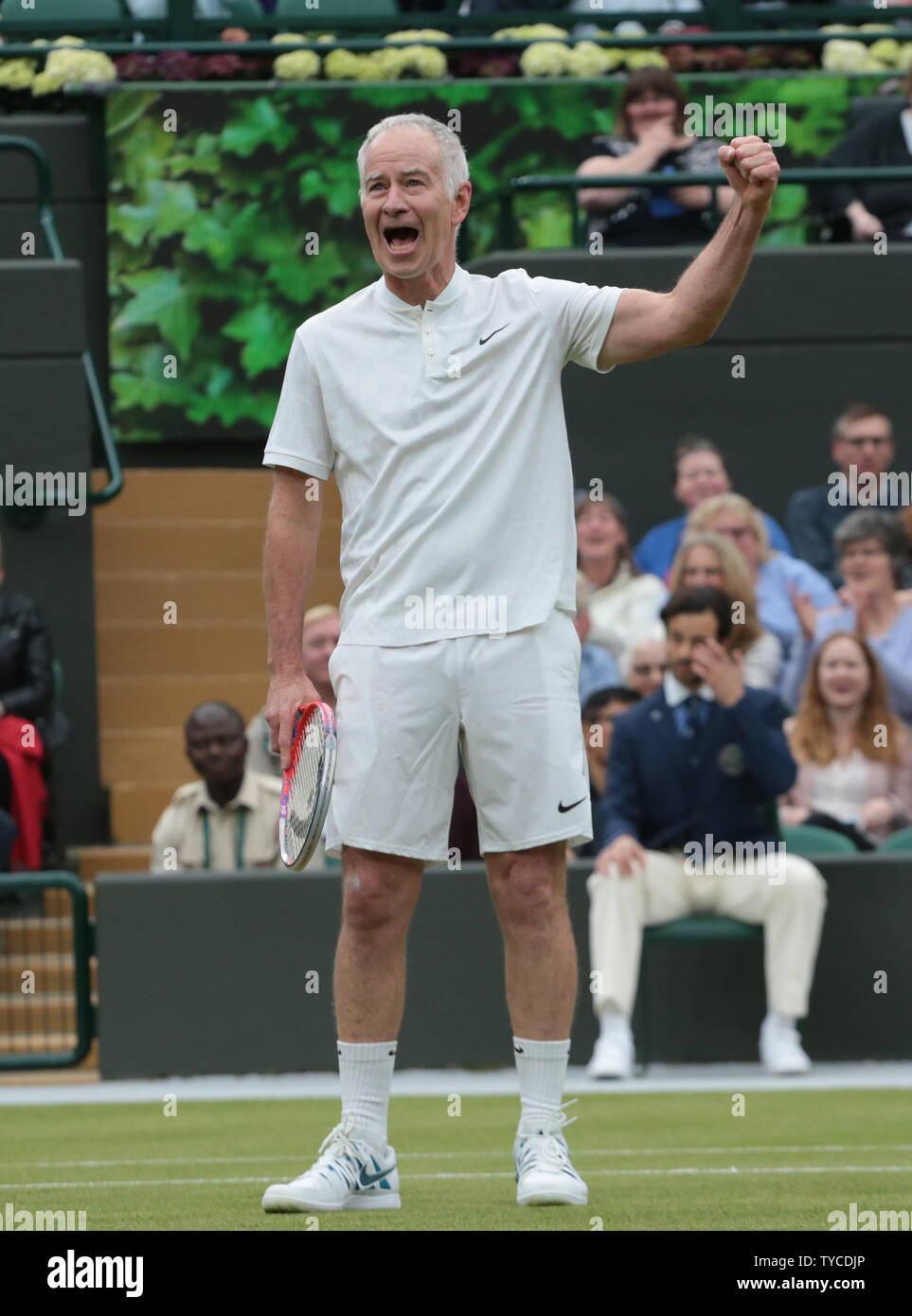 American John Mcenroe plays an exhibition doubles match against ...