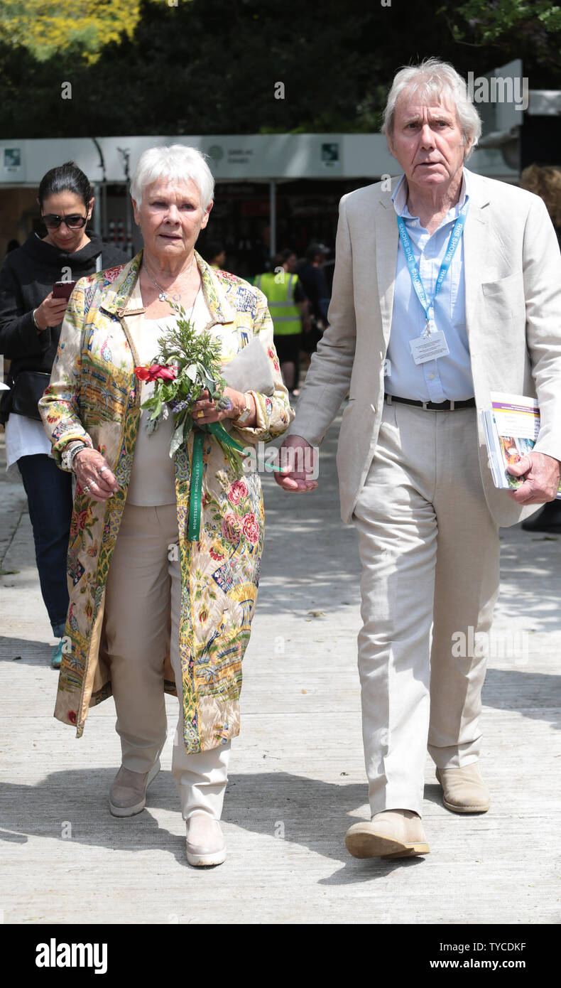 Actress Dame Judi Dench and her partner attend the Chelsea Flower Show ...