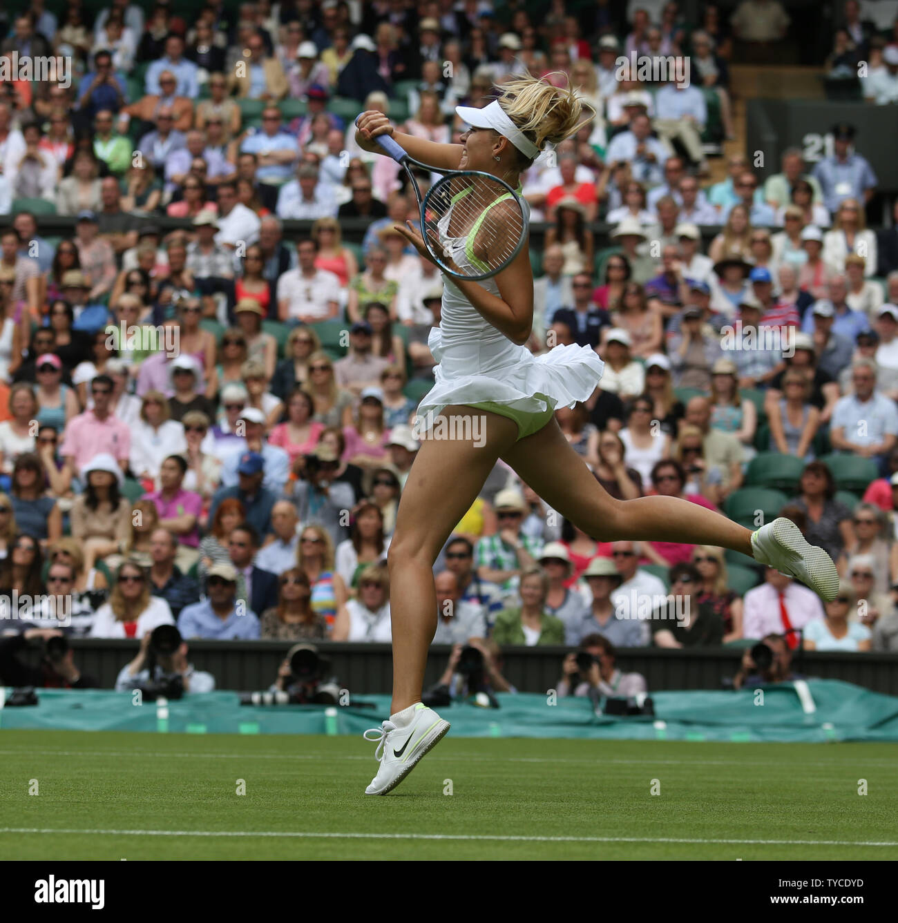 Russia's Maria Sharapova returns in her match against Australia's ...