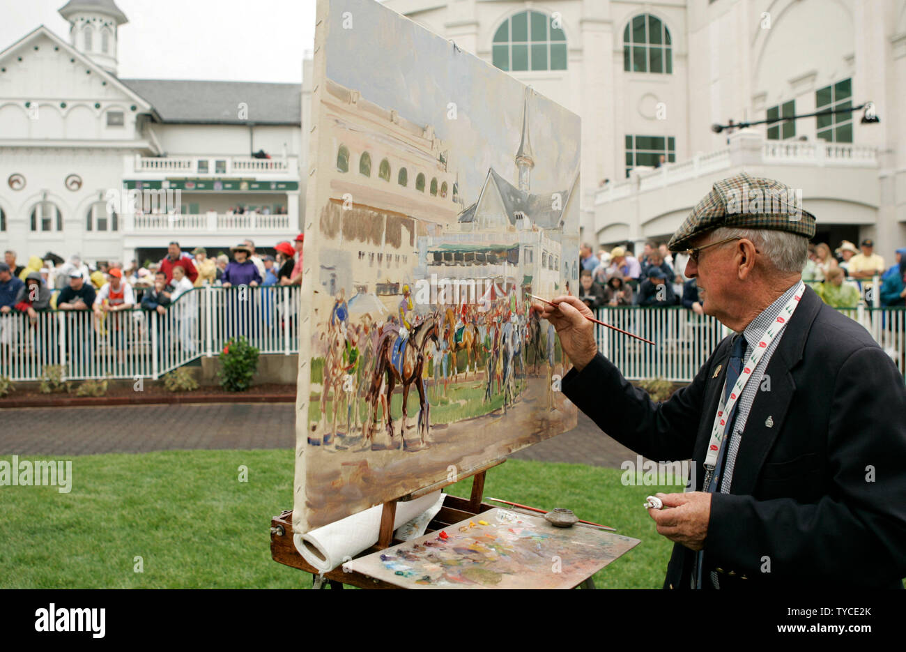 New Zealand artist Peter Williams paints in the paddock area of ...