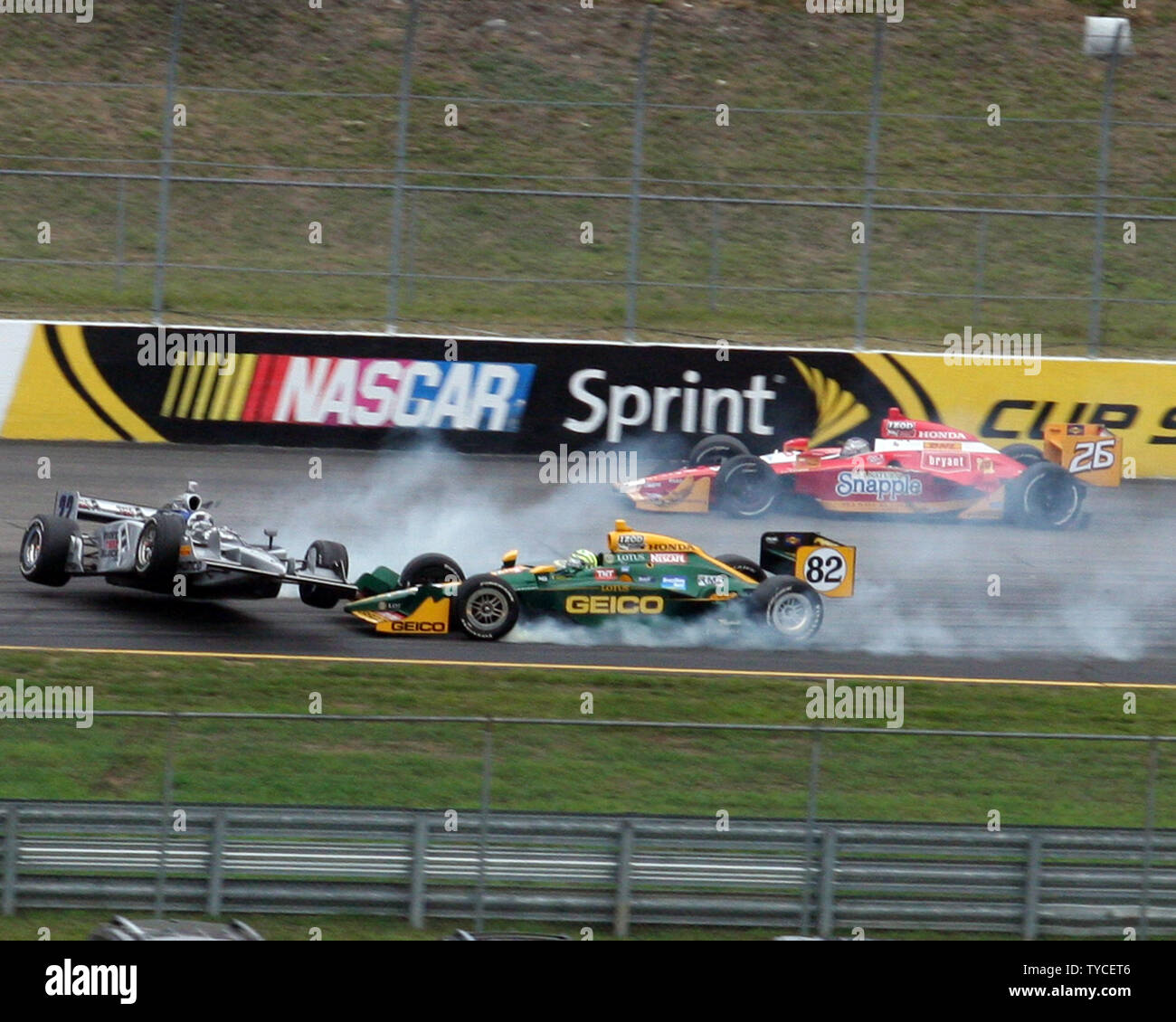 Tomas Scheckter (22), Tony Kanaan (82) , and Marco Andretti (26)crash ...