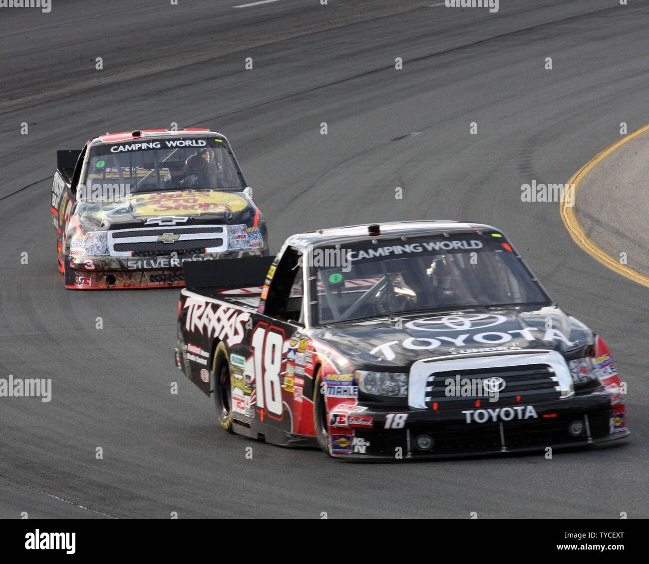 Kyle Busch (18) leads Austin Dillon (3) out of turn one during the ...