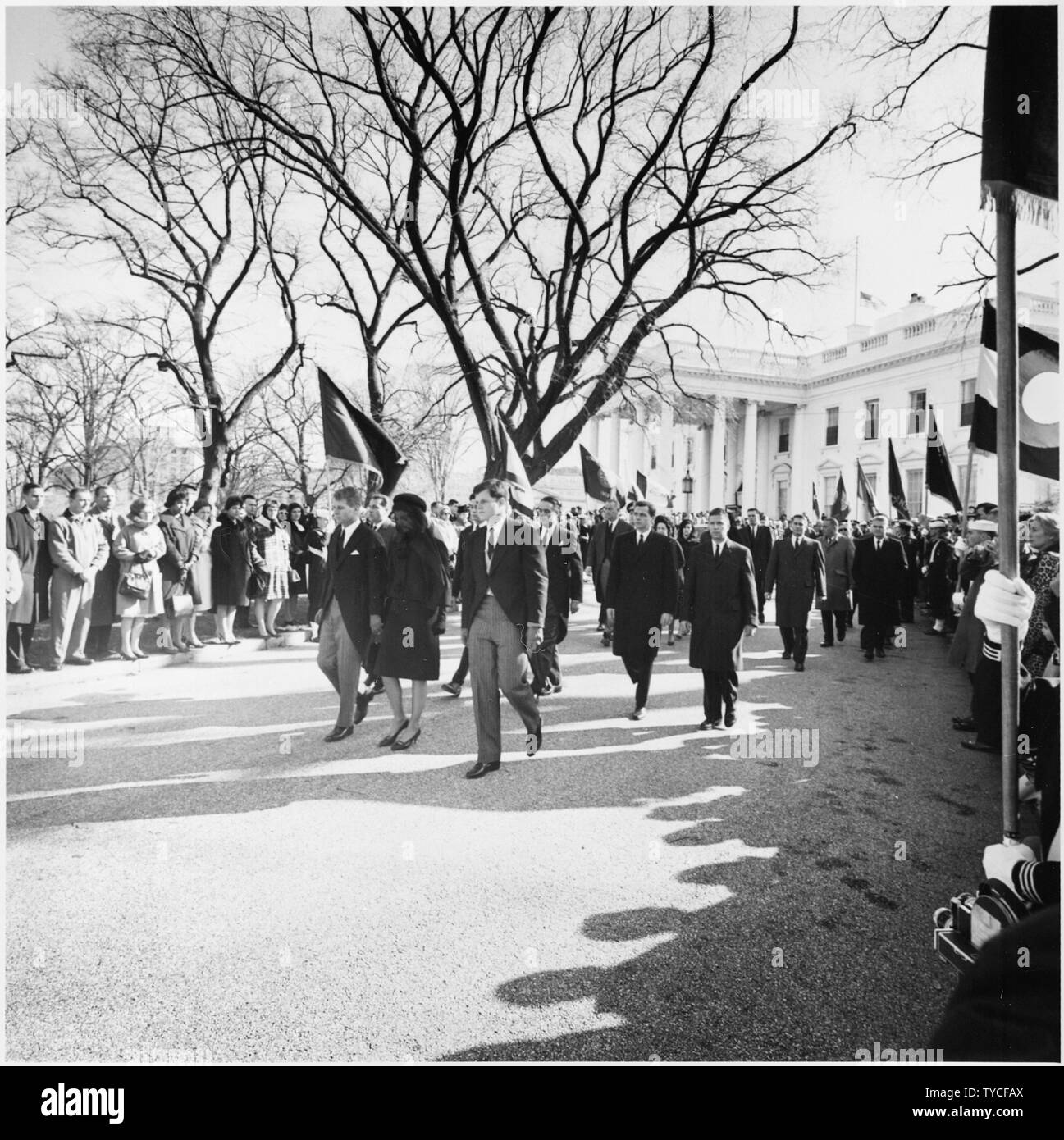 Photograph of Jacqueline Kennedy, accompanied by her brothers-in-law ...