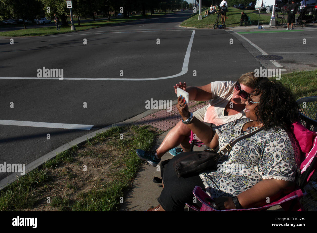 Bobbi Finch, left, and Bobbie McDonald take a photo as they wait for ...