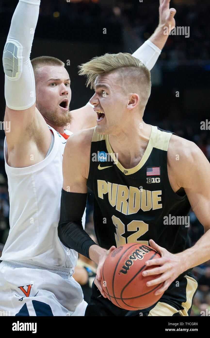 Purdue Boilermakers center Matt Haarms (32) shoots a basket around ...
