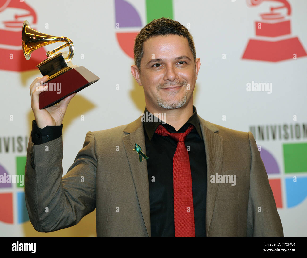 Singer Alejandro Sanz appears backstage with his award for Best Male ...
