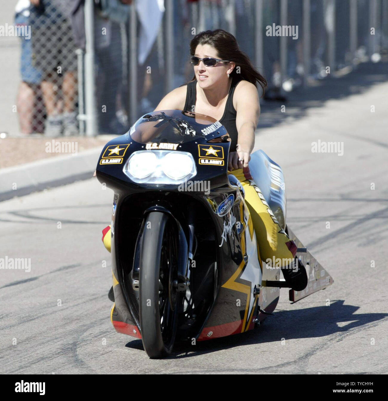Angelle Savoie, 2002 National NHRA champion heads for the pits after ...