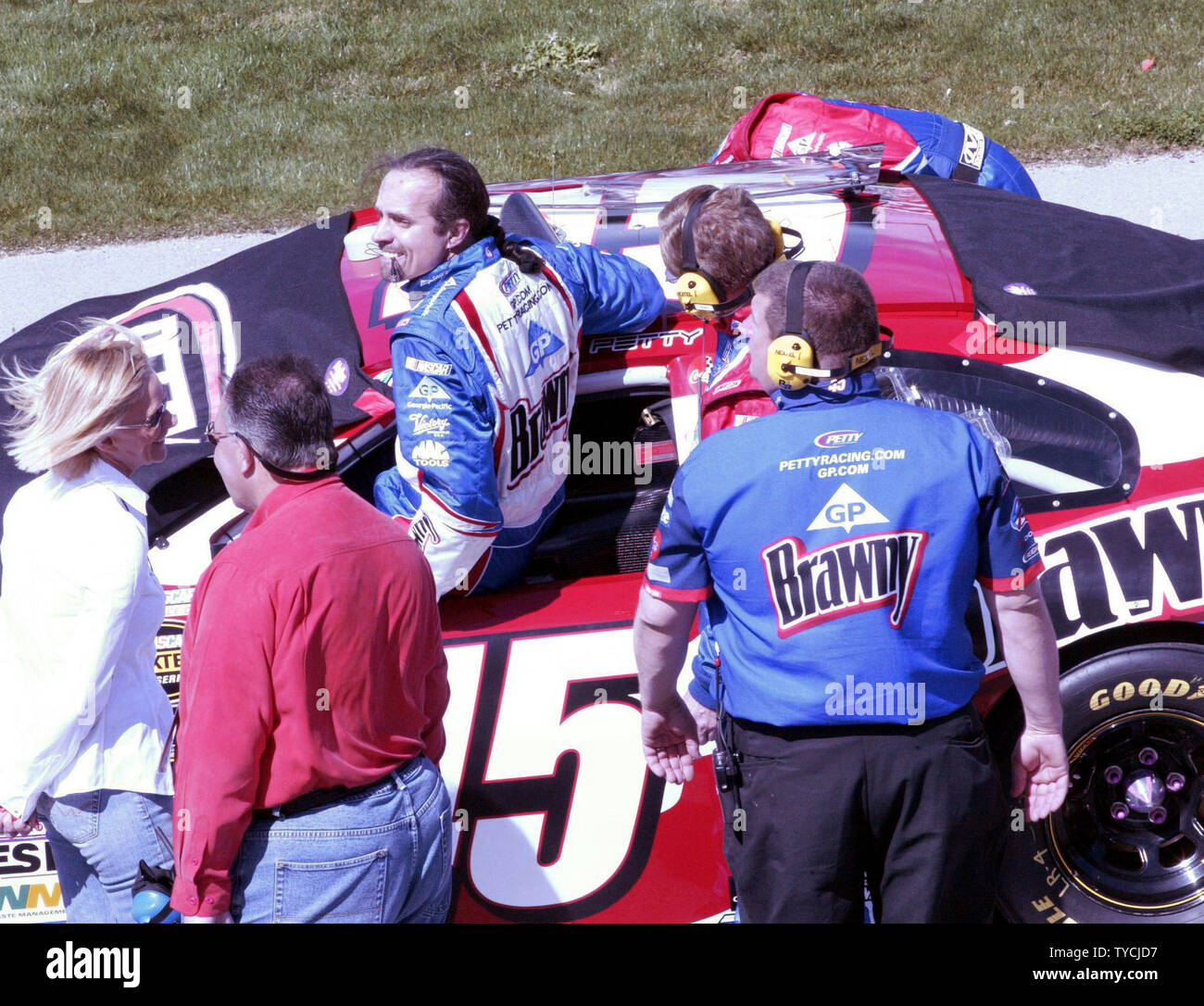 Scott Riggs enters his car at the start of the UAW-DaimlerChrysler 400 ...