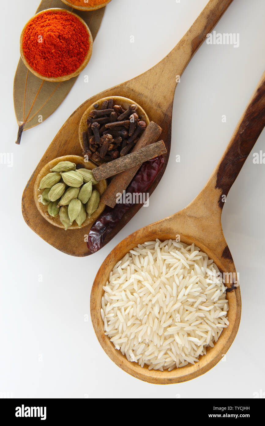 Assorted spices with white rice Stock Photo - Alamy