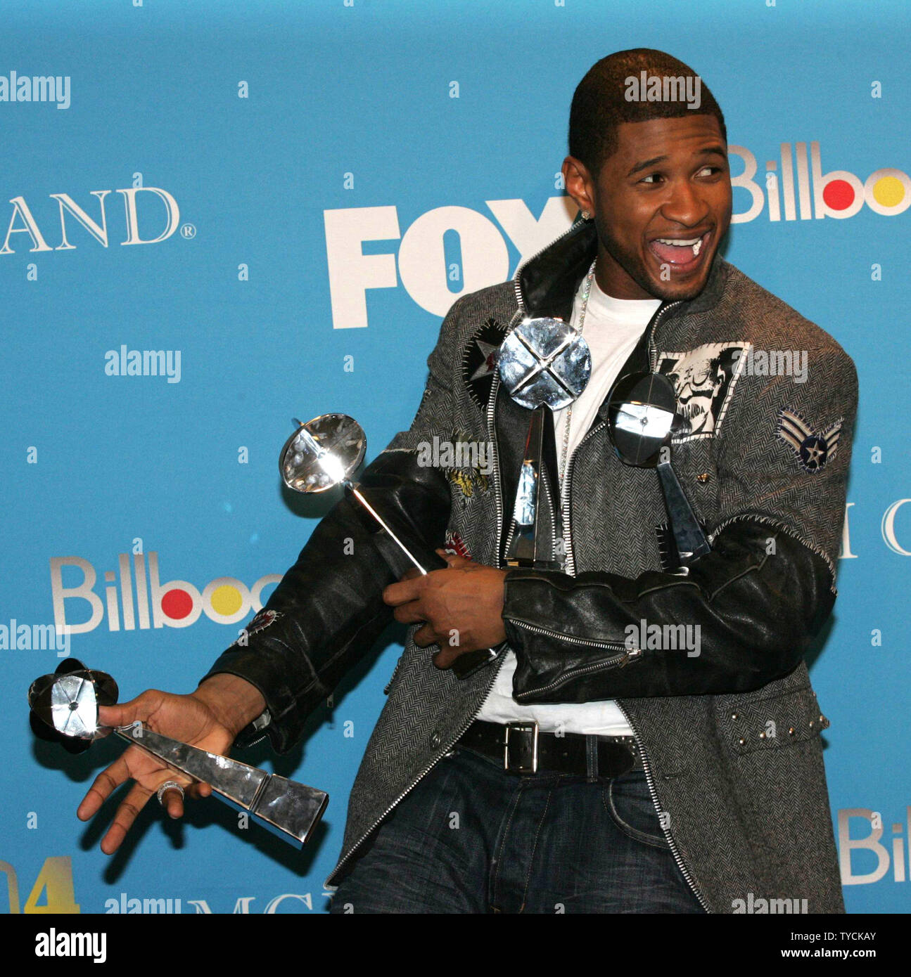 Usher celebrates winning a total of 11 awards at the 2004 Billboard ...