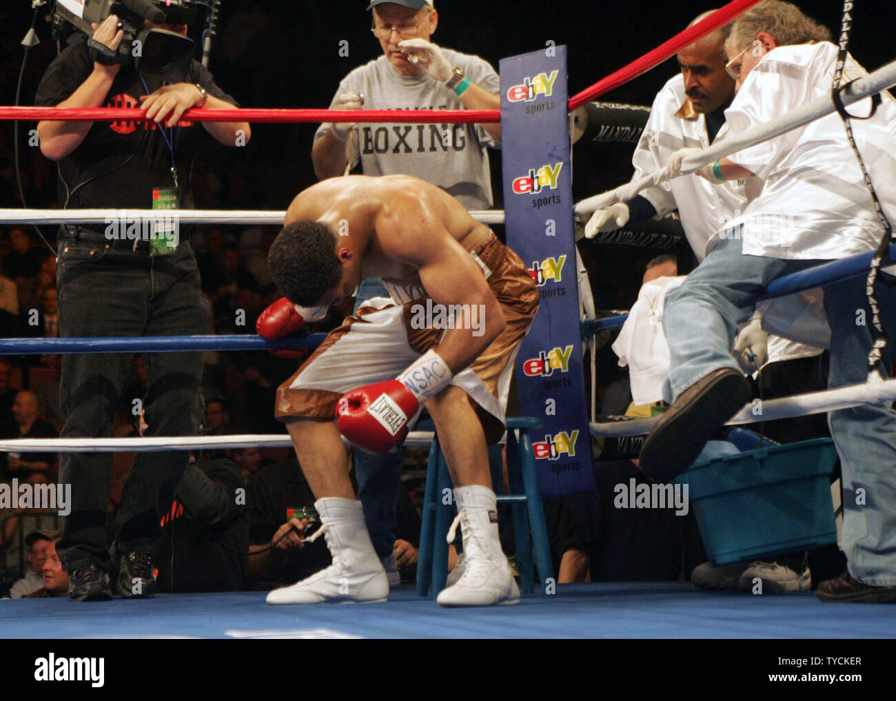Challenger Rubin Williams of Detroit, MI, collapses in his corner at ...