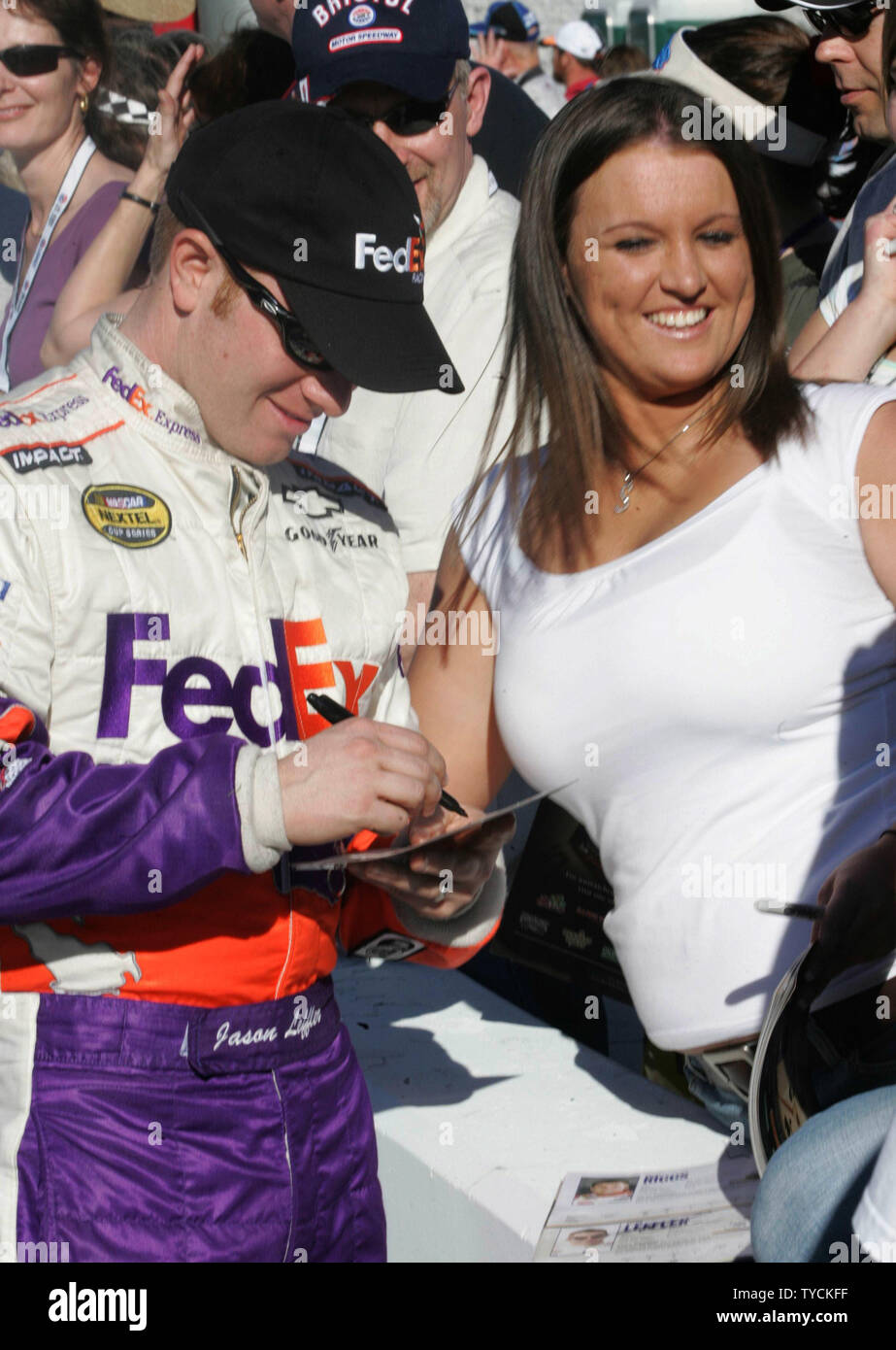 Jason Leffler signs autographs as he awaits his qualifying run for the ...