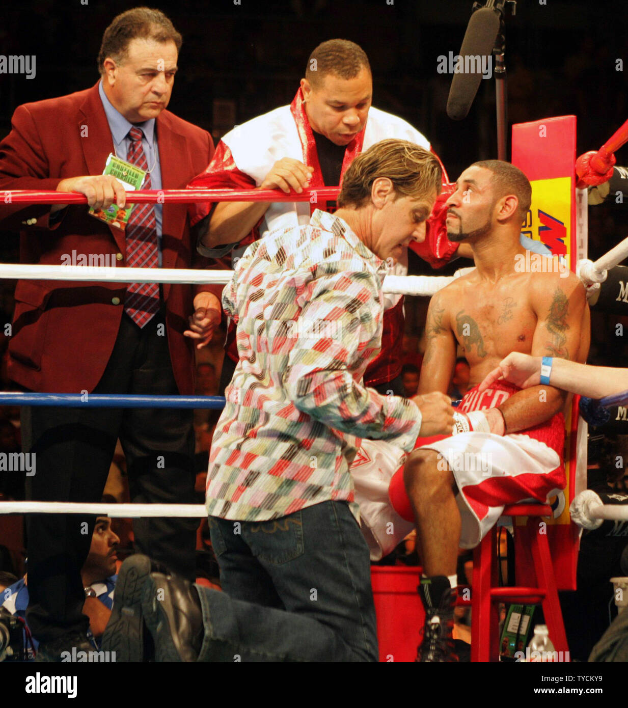 WBO Lightweight champion Diego "Chico" Corrales takes instructions from trainer Joe Goosen ...