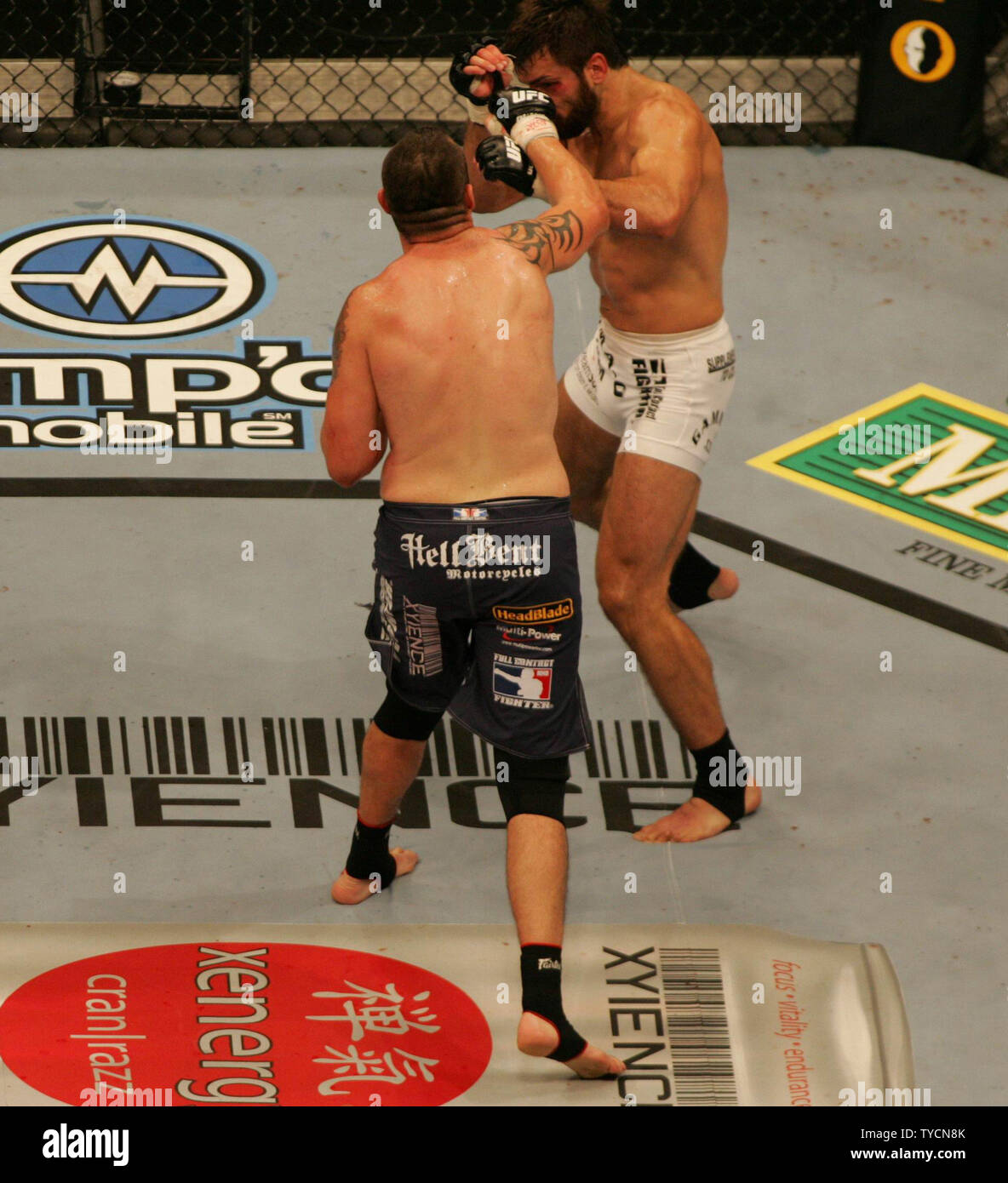 UFC world heavyweight champion Andrei Arlovski (front) defends his ...
