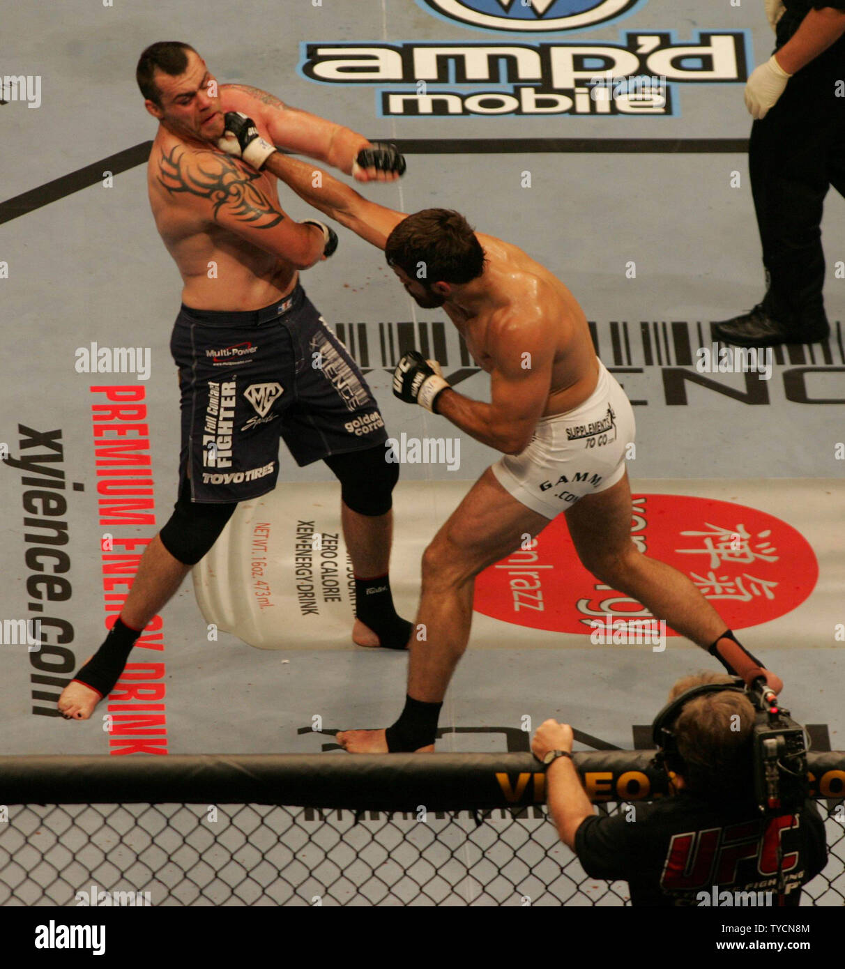 UFC world heavyweight champion Andrei Arlovski (left) defends his title ...