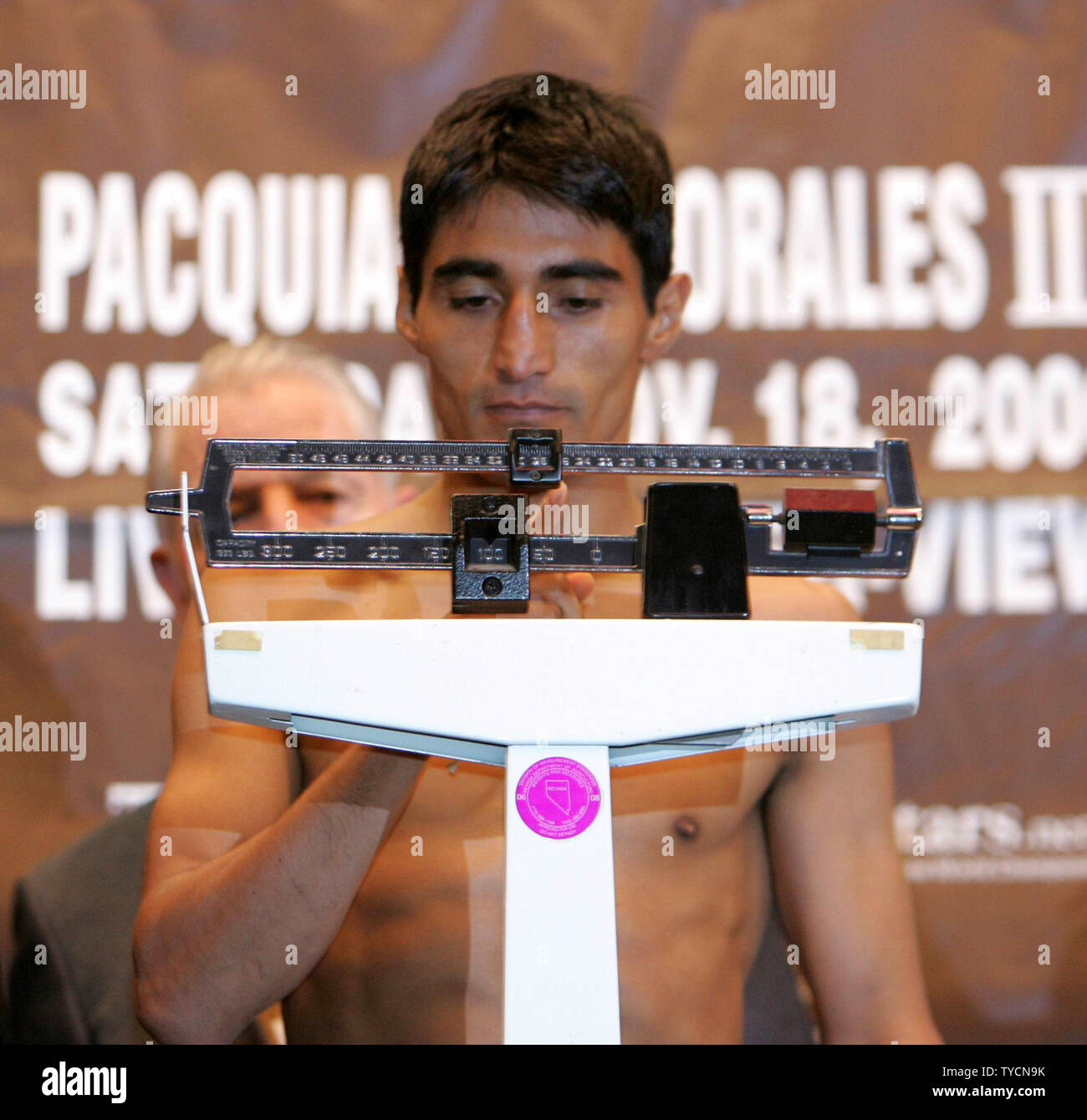 Eric Morales of Mexico weighs in at 129 pounds for his rubber title ...