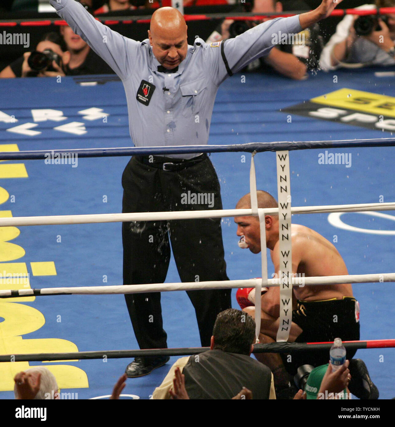 Referee Joe Cortez reaches the count of ten and declares Super ...