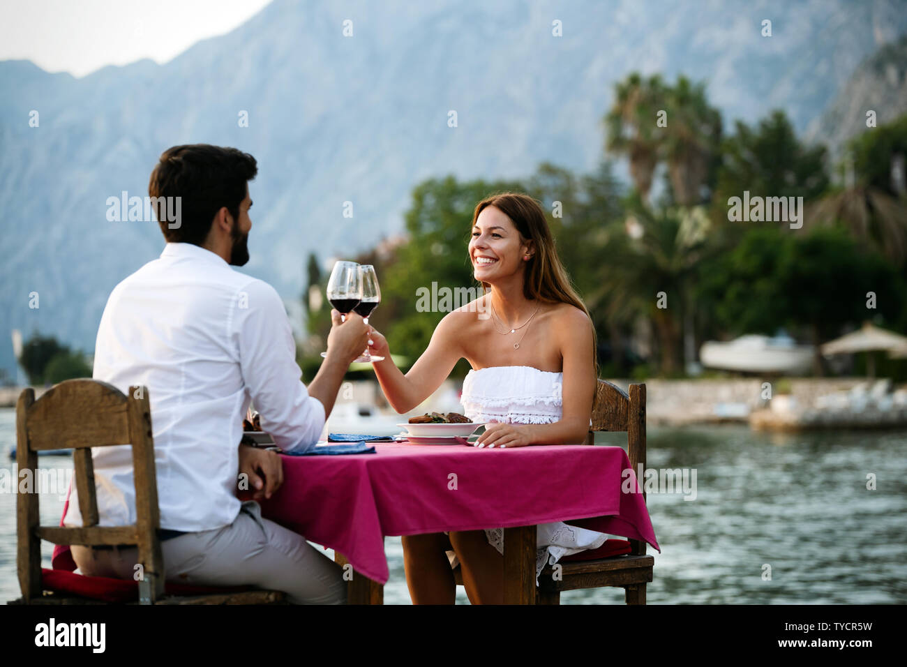 Couple sharing romantic sunset dinner on tropical resort Stock Photo ...
