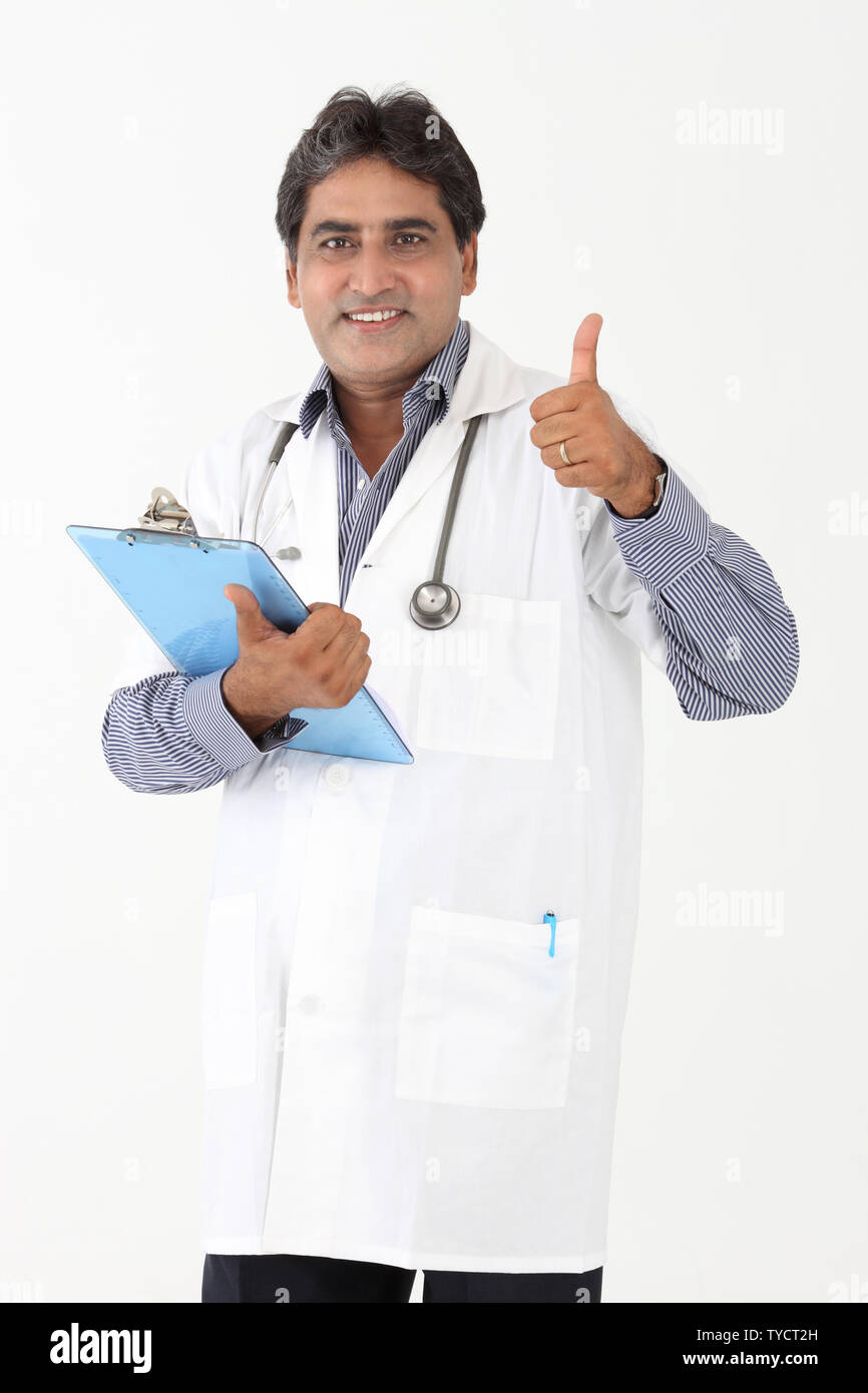 Male doctor showing thumbs up sign Stock Photo - Alamy