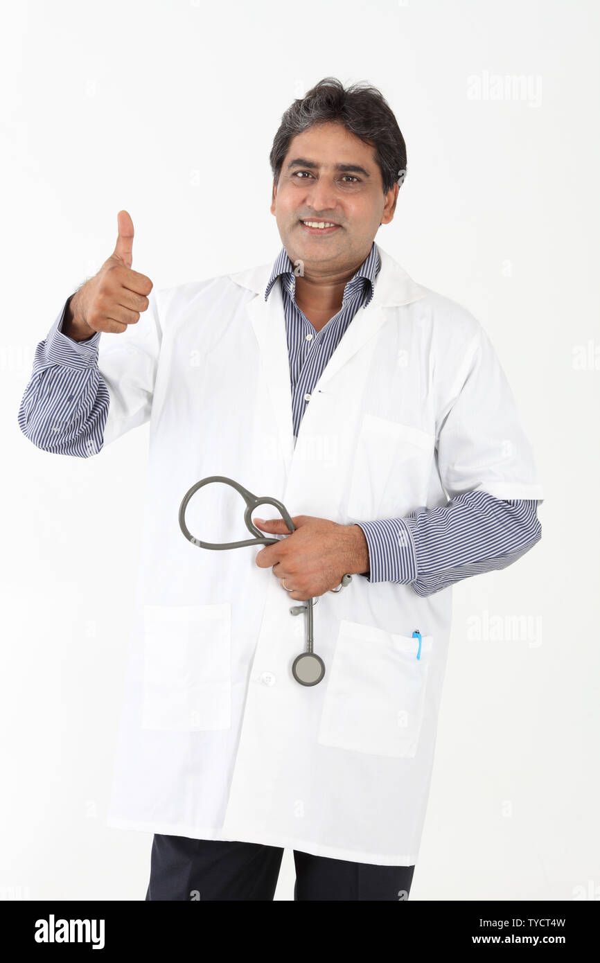 Male doctor showing thumbs up sign Stock Photo - Alamy