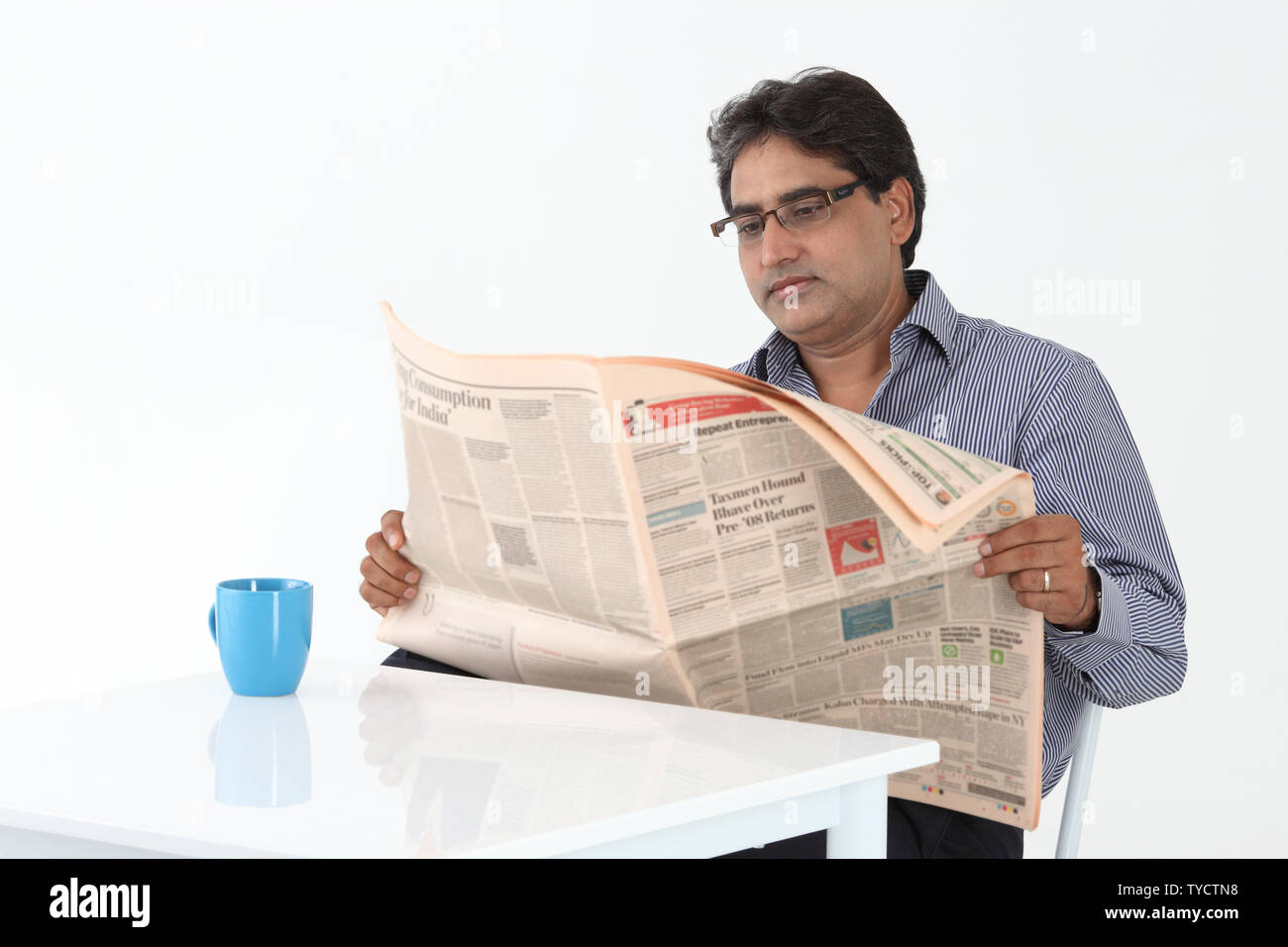 Man reading a newspaper Stock Photo - Alamy