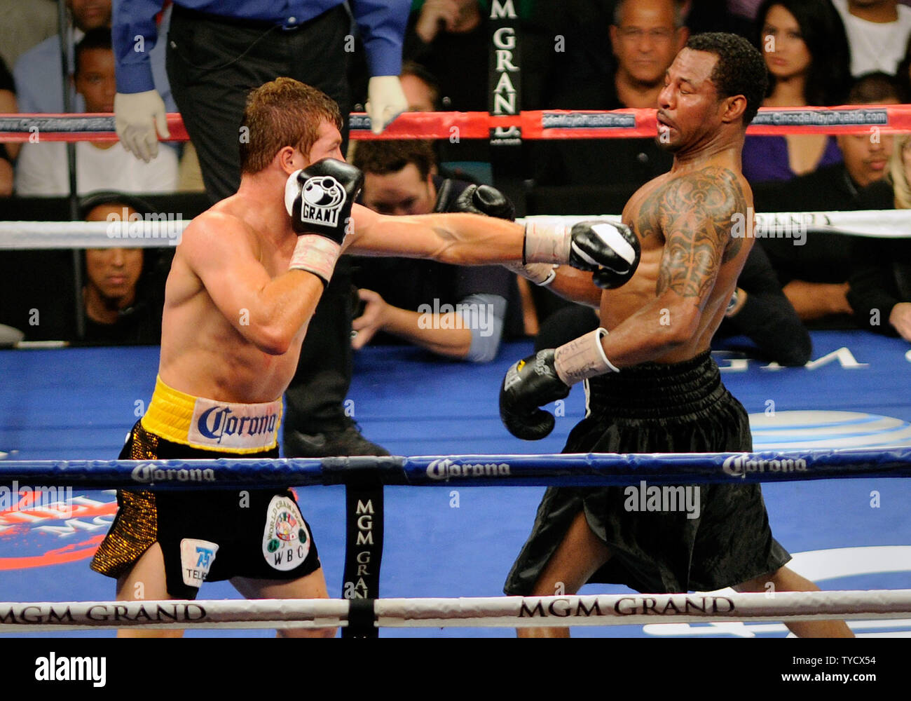 Boxer Canelo Alvarez, left, of Mexico, punches Shane Mosley of Pomona ...