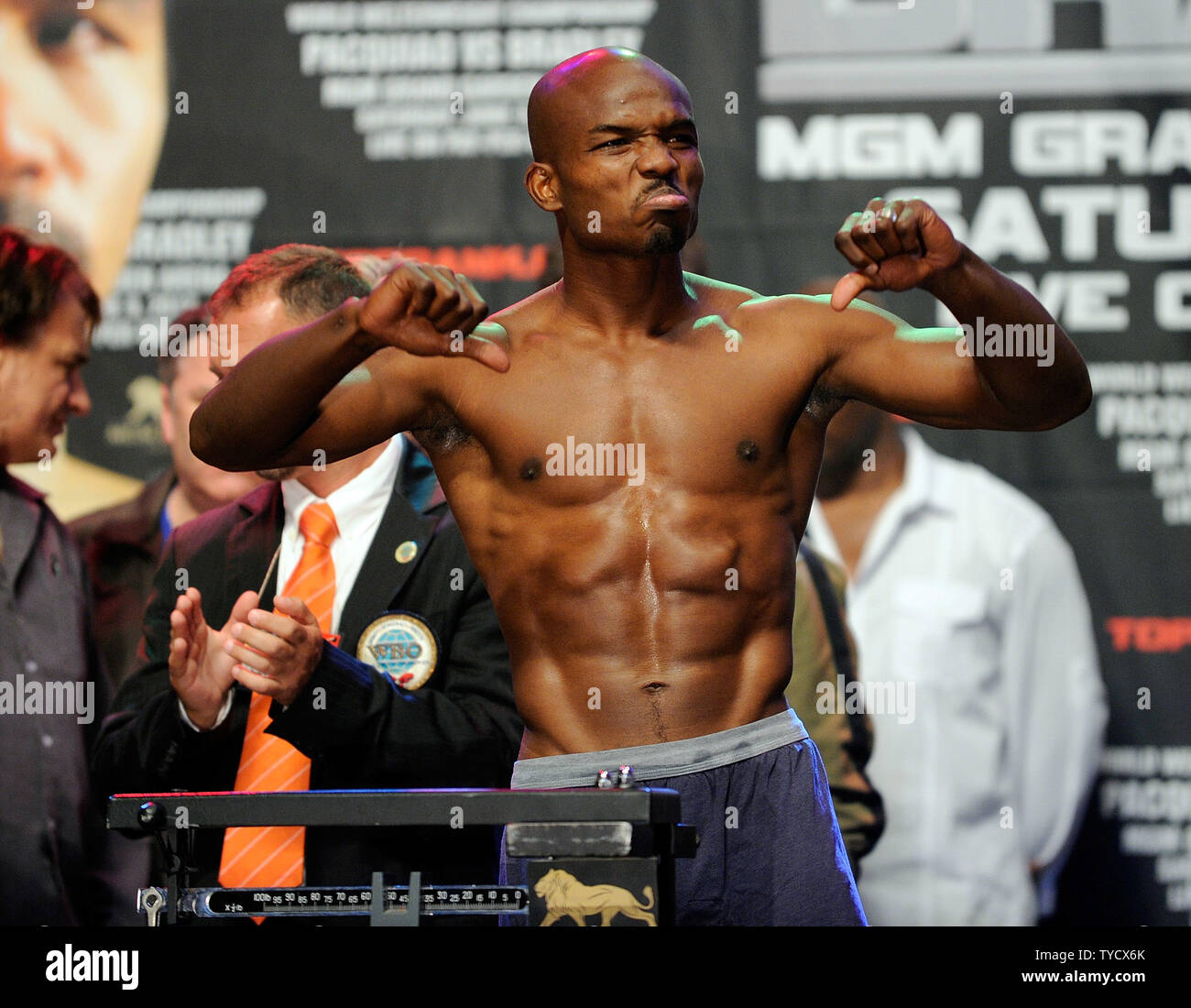 Boxer Timothy Bradley of Palm Springs, Calif., poses on the scale ...