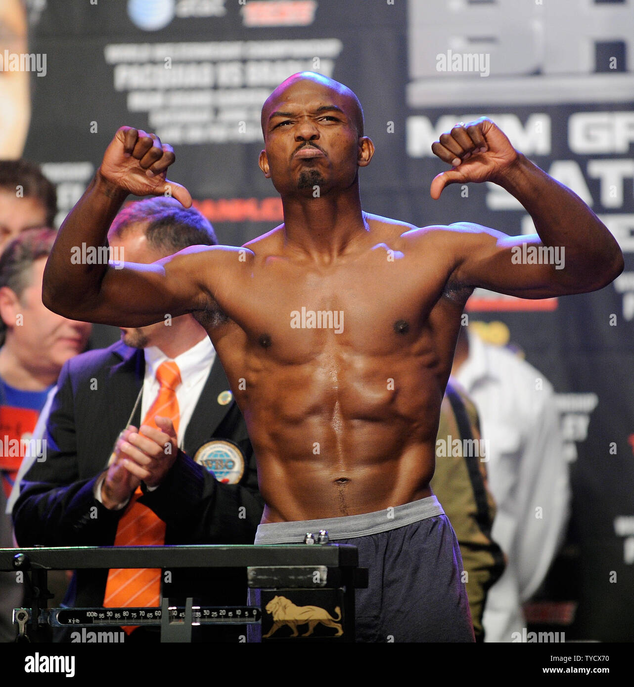 Boxer Timothy Bradley of Palm Springs, Calif., poses on the scale ...