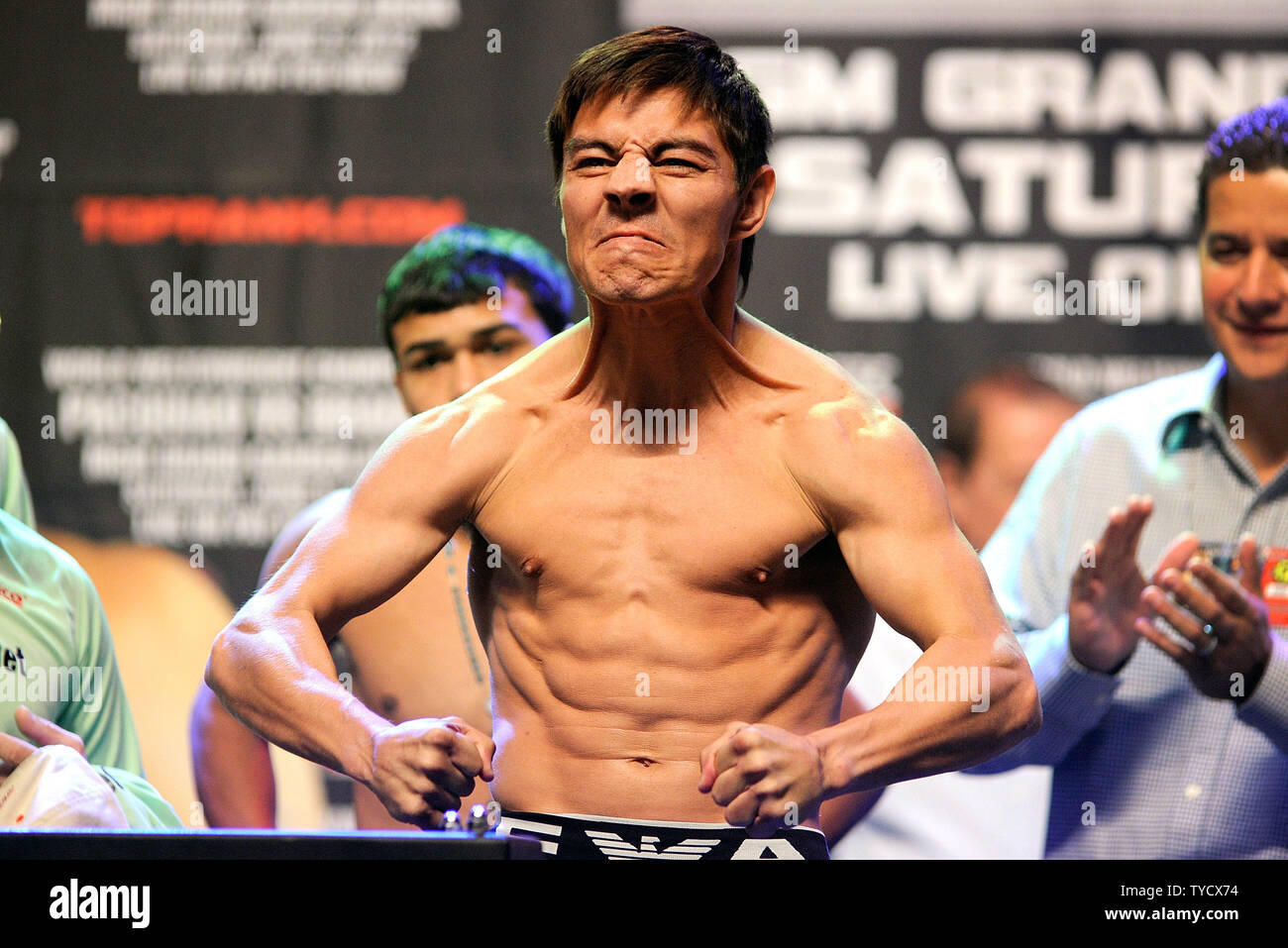 Boxer Jorge Arce of Mexico, poses on the scale during the official ...