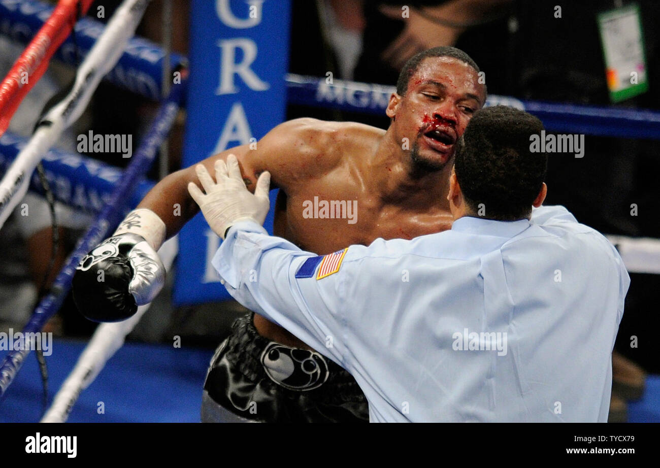 Boxer Mike Jones of Philadelphia is held up by referee Tony Weeks after ...